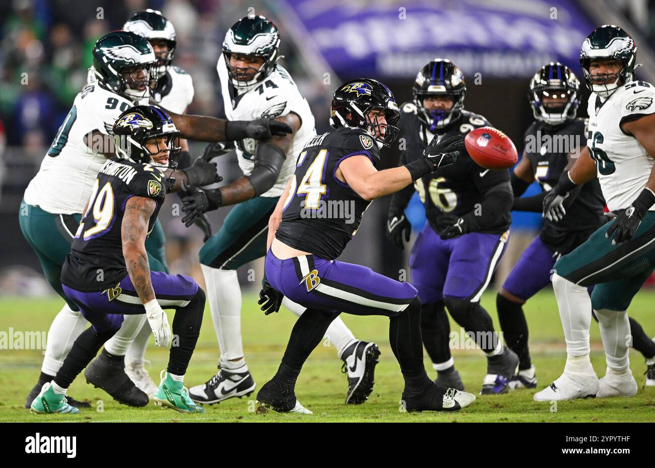Baltimore Ravens linebacker Kristian Welch (54) and defensive lineman ...