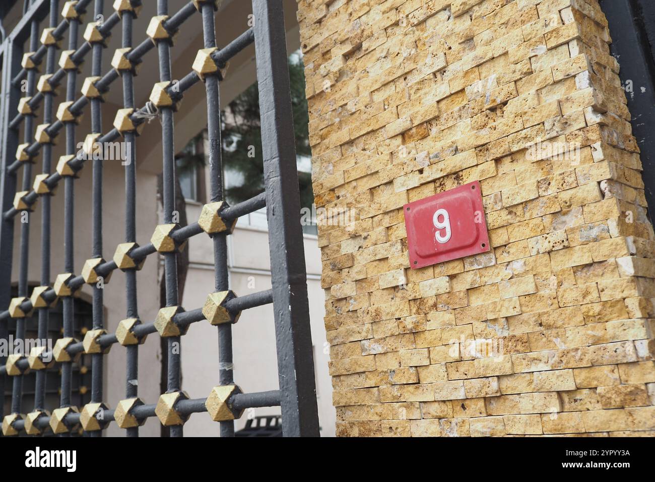 An Elegant Gate Design Complemented by a Number 9 House Sign Display ...