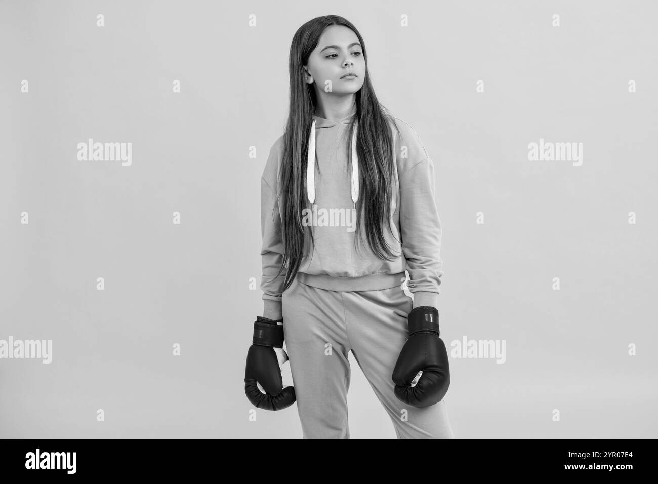 proud teen girl boxer learn punching at sport training in active wear ...