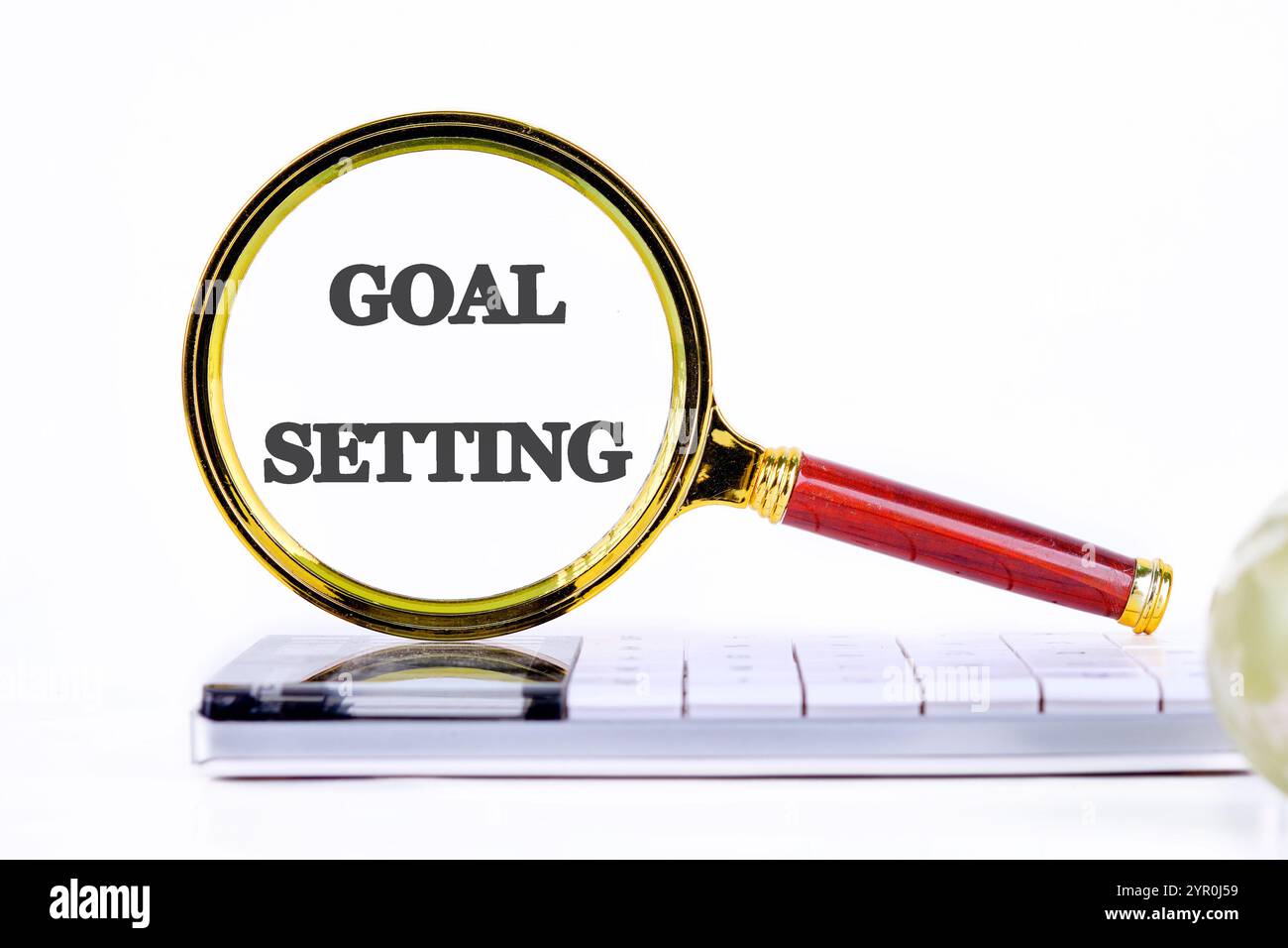 Business concept. The GOAL SETTING concept phrase written on through a ...