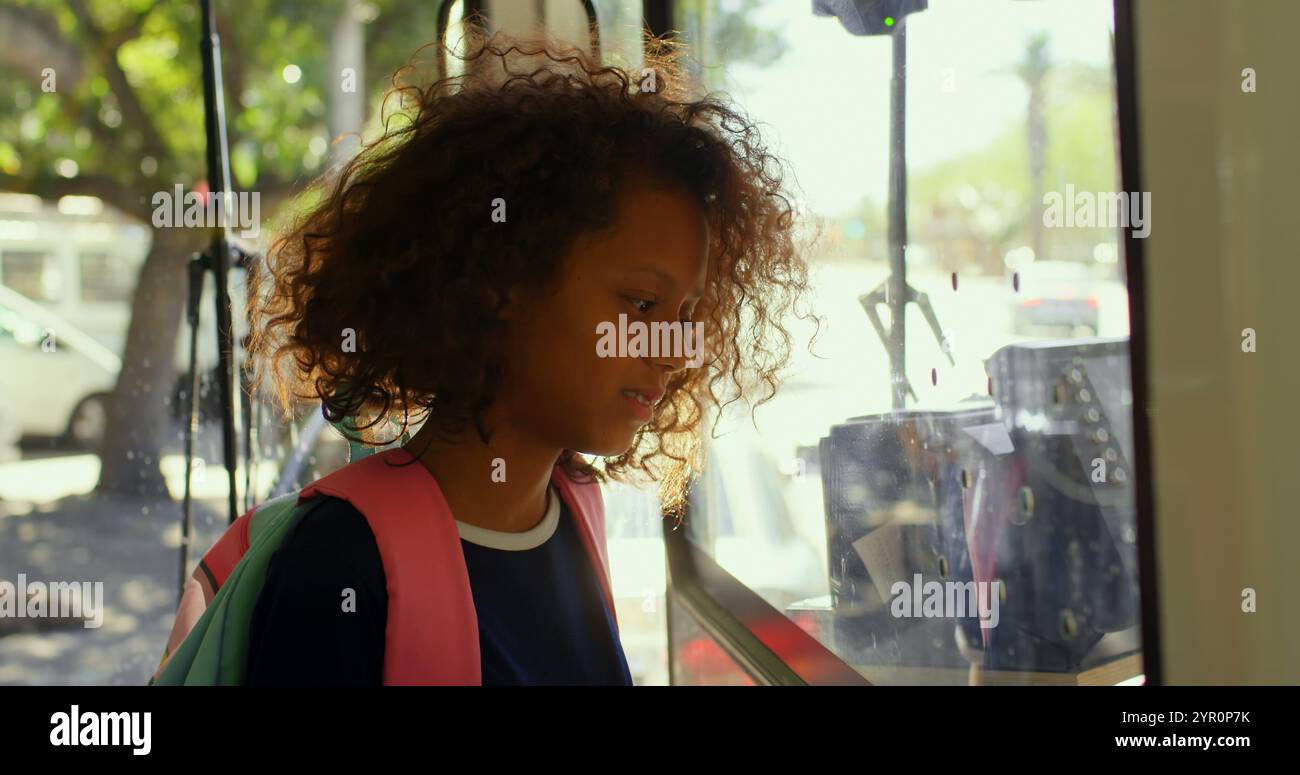 Happy girl travelling in bus Stock Photo - Alamy