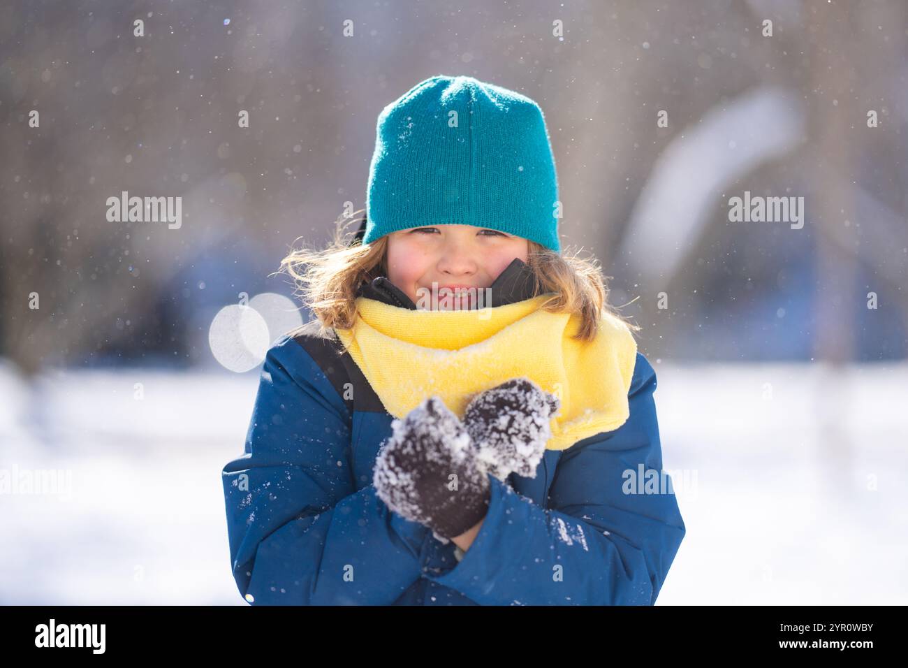 Happy kids playing snowball fight hi-res stock photography and images ...