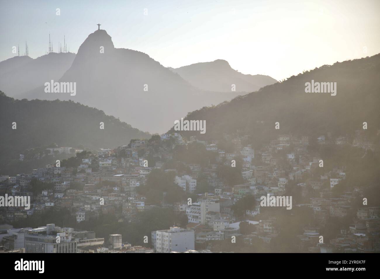 Christ the Redeemer on top of the Corcovado (left) and Babilônia favela ...