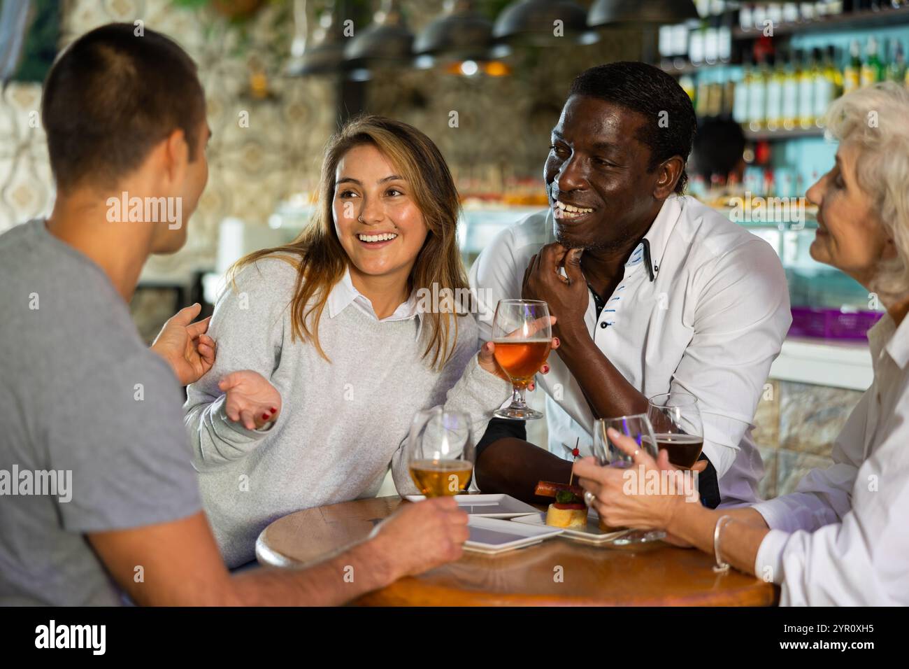 View on the African and Latina couple talking Stock Photo - Alamy