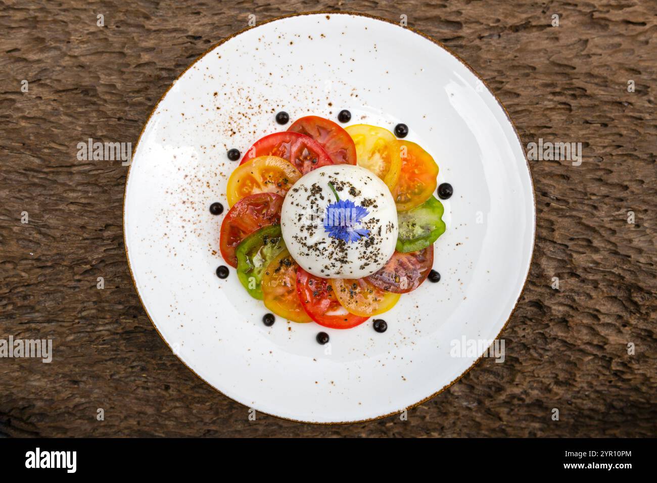 Burrata di bufala and heirloom tomato salad with Xeres vinegar Stock ...