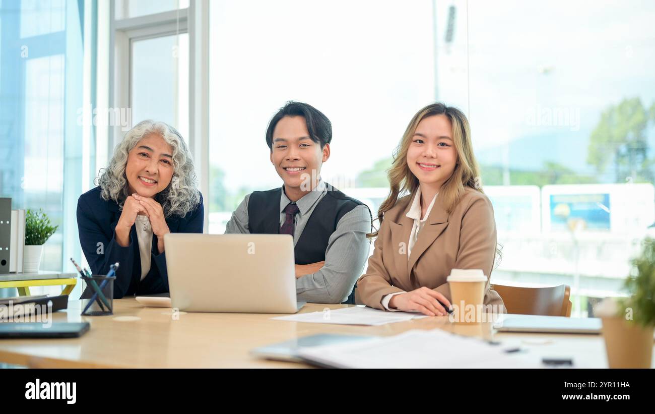 Happy employees working office setting hi-res stock photography and ...