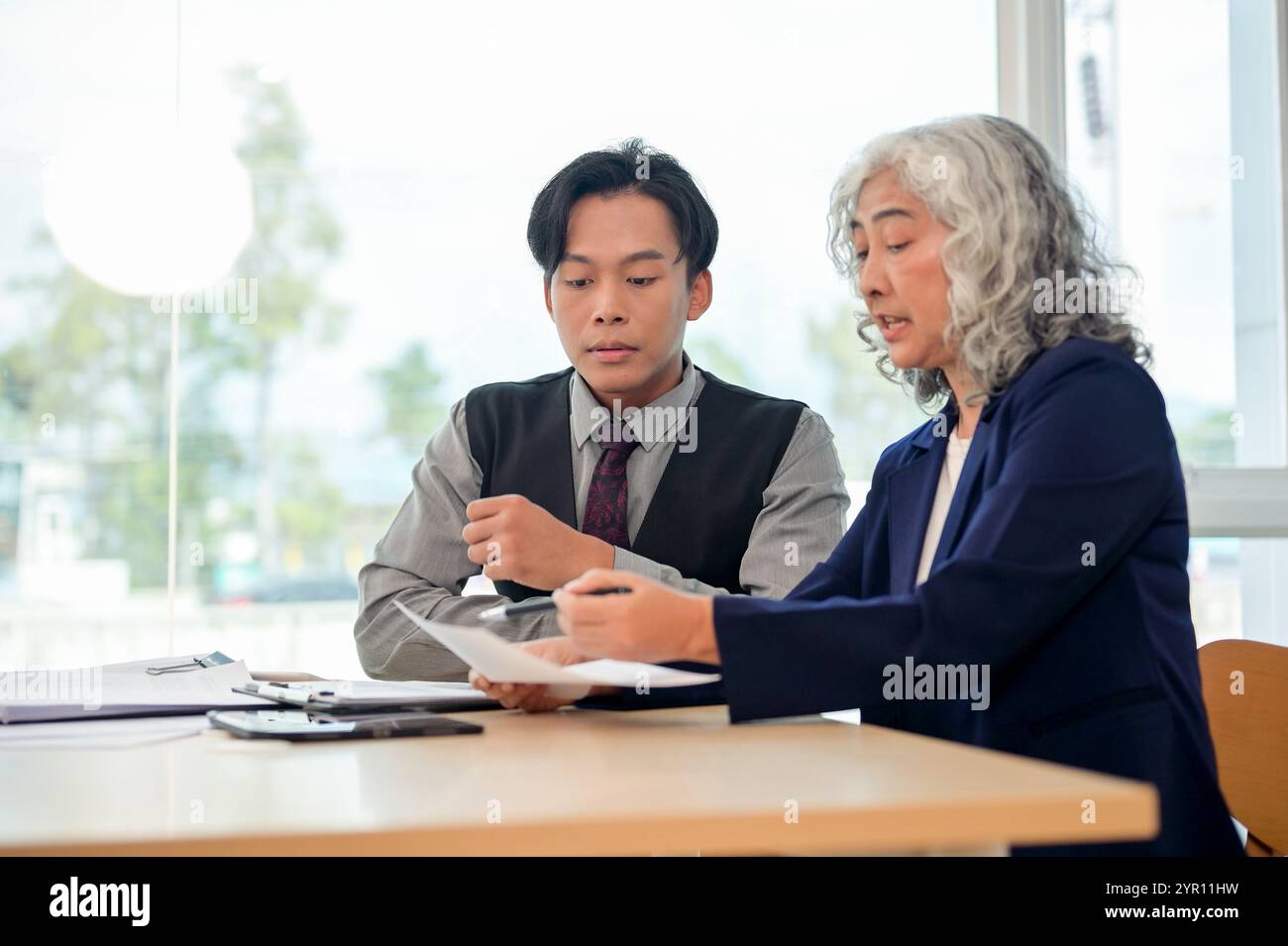 Serious young female lawyer sitting hi-res stock photography and images ...