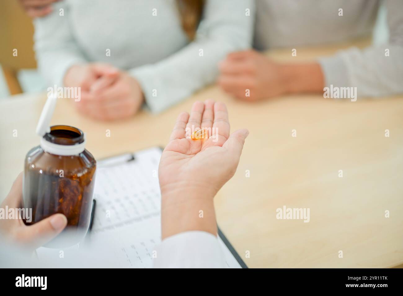 A close-up of a doctor explaining the instructions for the medication ...