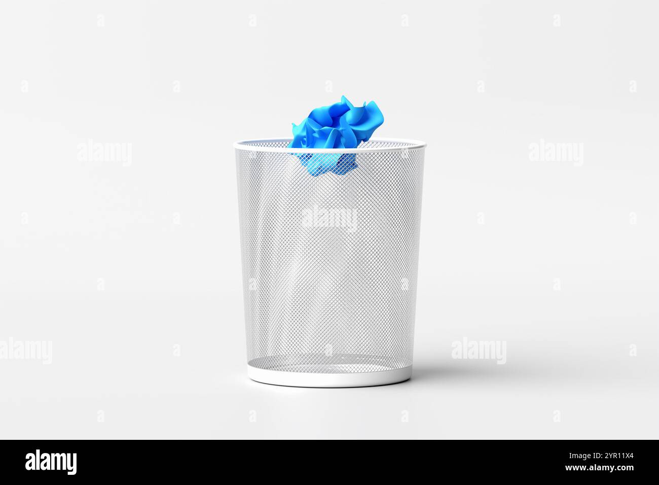 Blue crumpled paper thrown into the office trash bin on white ...