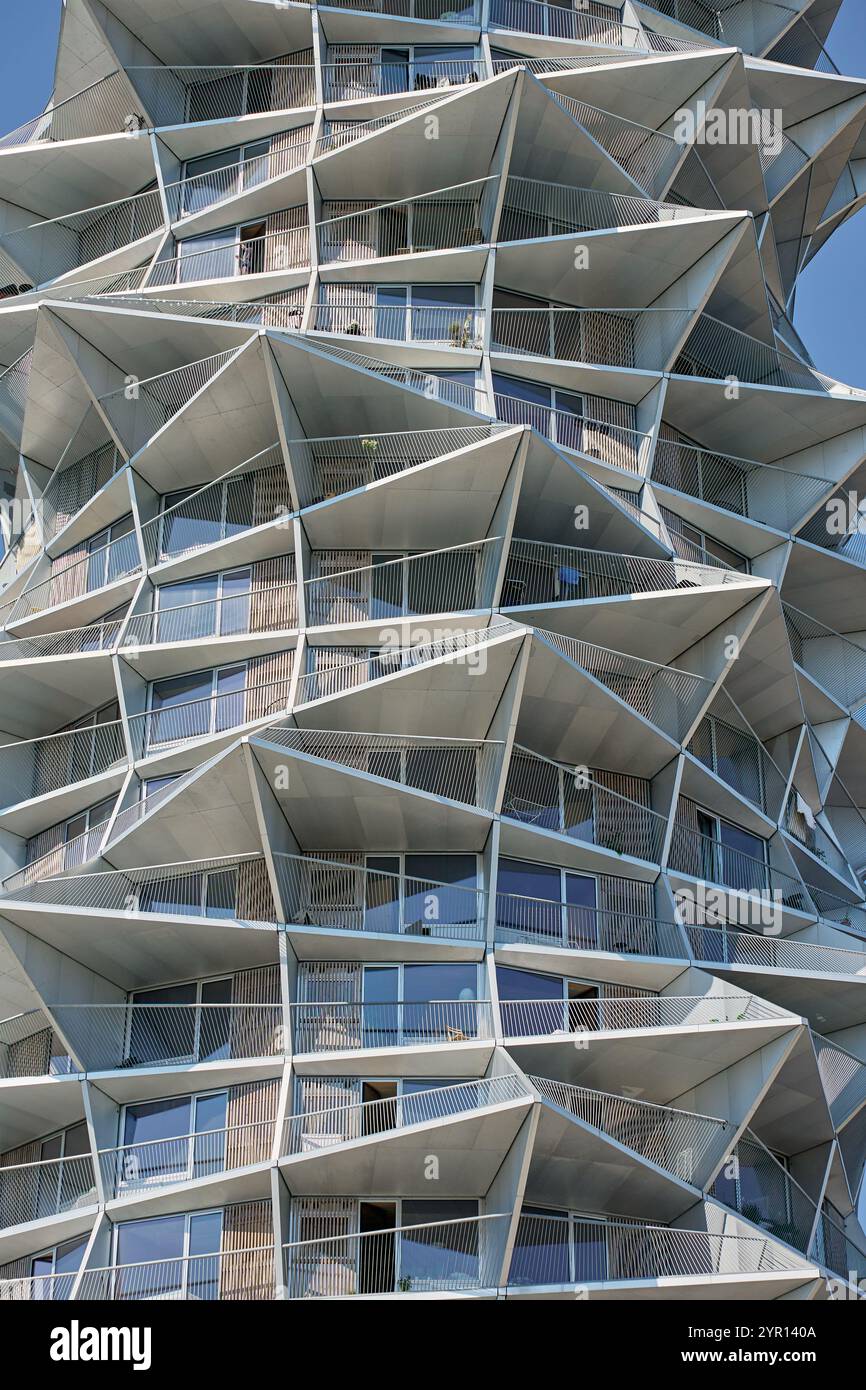 Facade of modern residential building with geometric shapes against ...