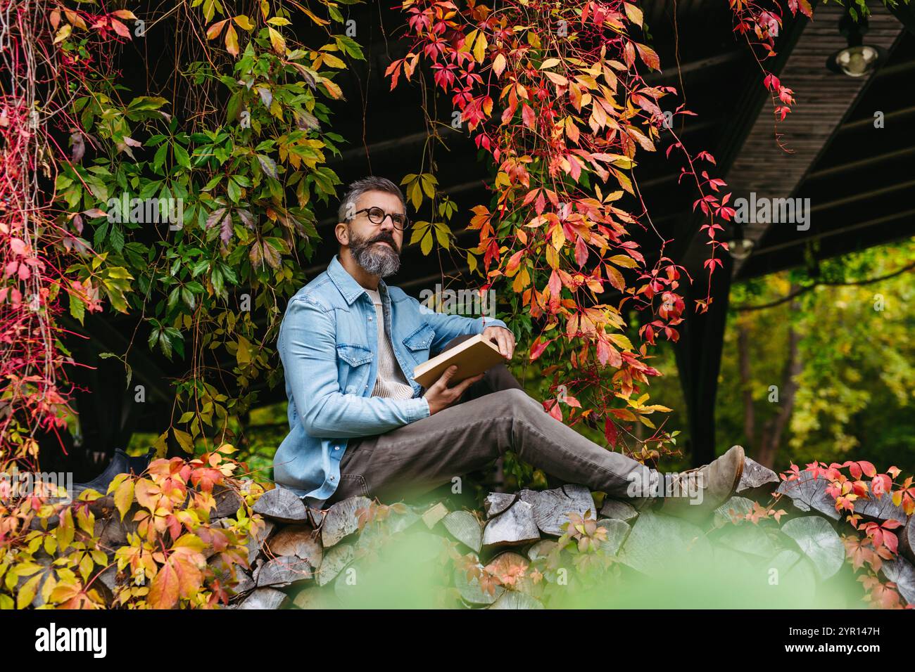 Man is enjoying a relaxing, peaceful moment at home, sitting among ...