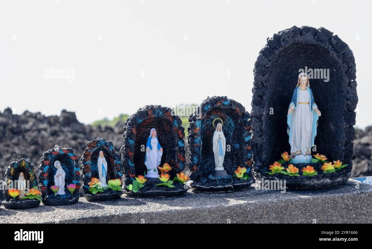 Small statues of the Madonna inside a small volcanic lava cave on sale ...