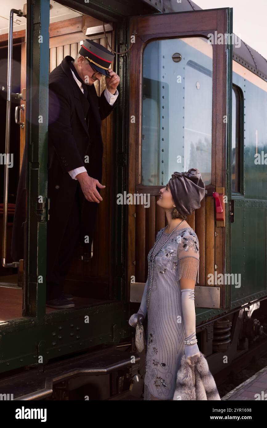 Lady in 1920s flapper dress costume entering the first class carriage ...