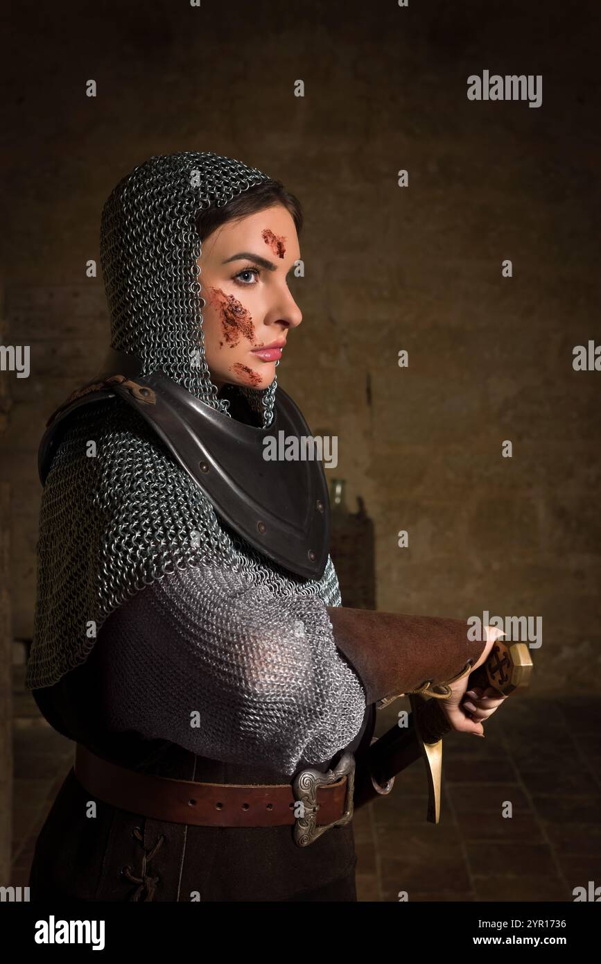Reenactment scene of a female medieval knight in armor depicting the ...