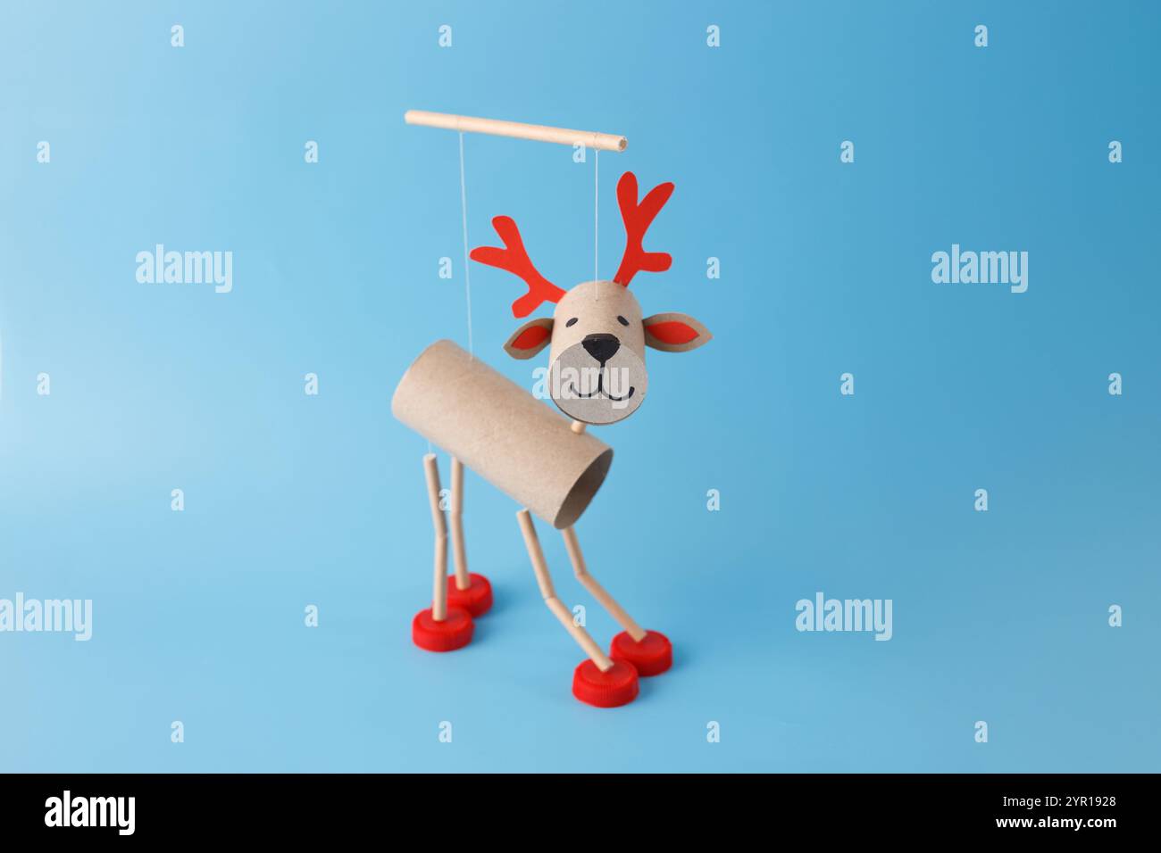 DIY reindeer puppet made from cardboard tubes, red bottle caps, paper ...