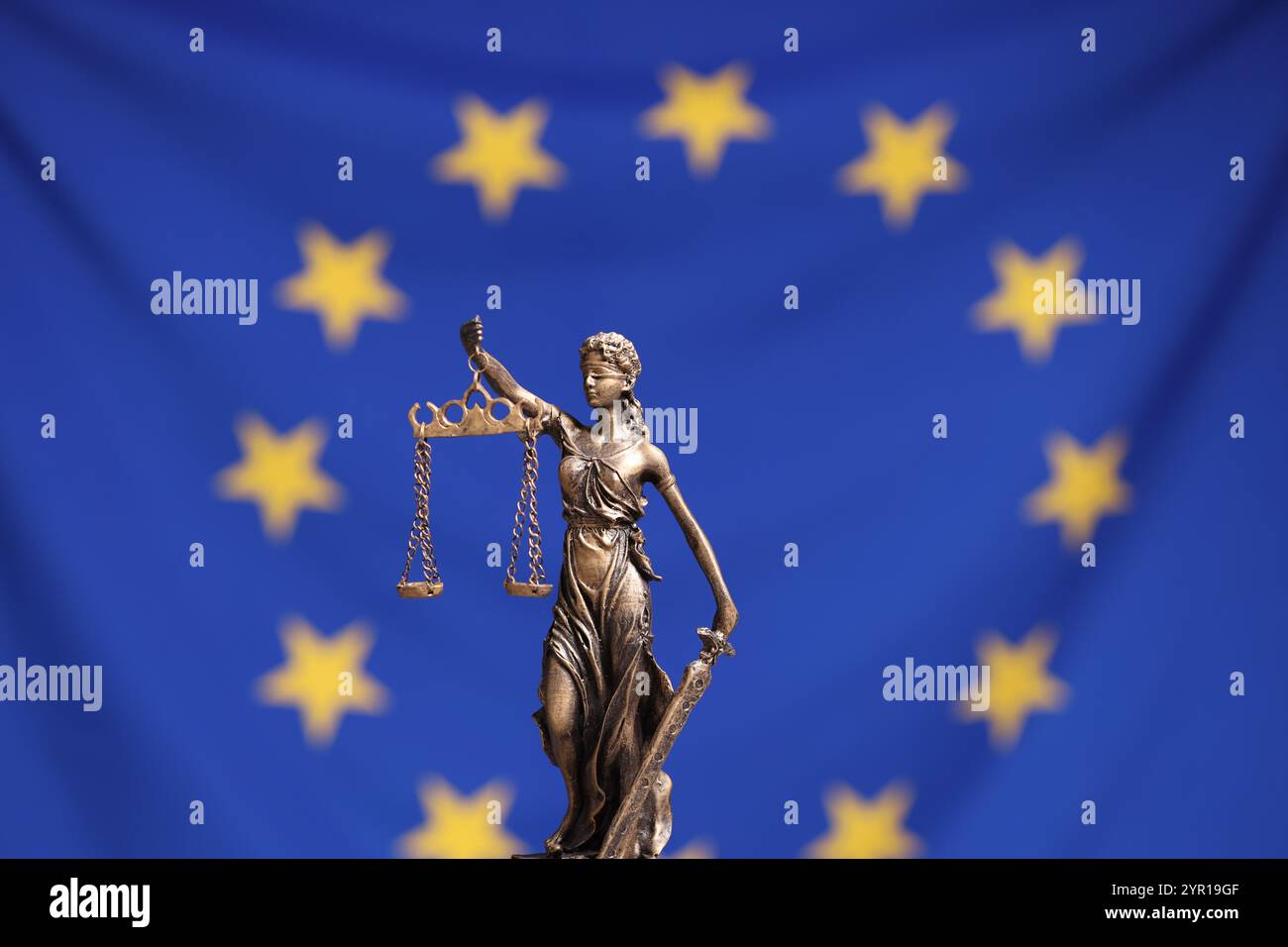 Figure of Lady Justice against European Union flag Stock Photo - Alamy