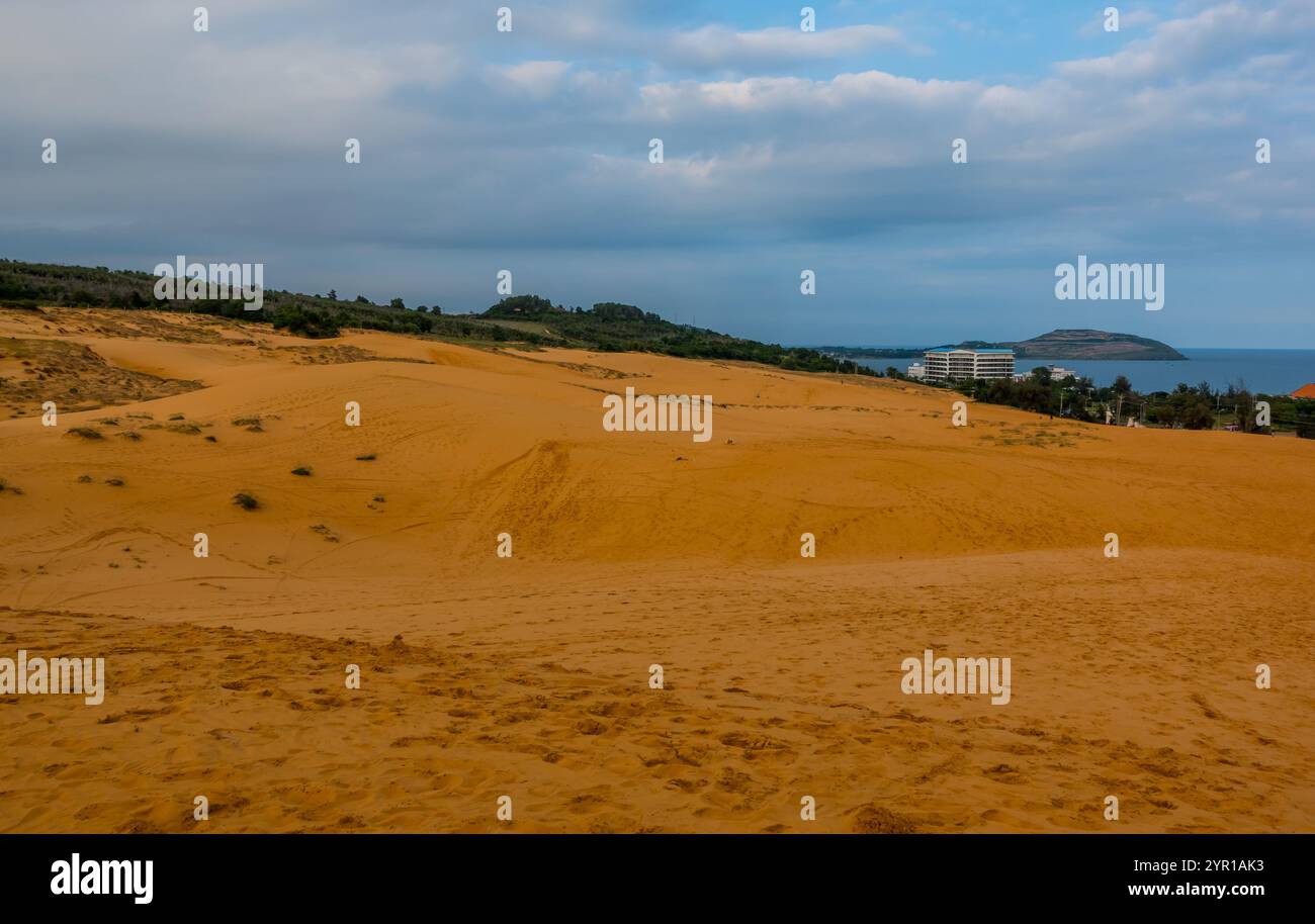 The stunning red sand dunes in Mui Ne, Vietnam at sunset Stock Photo ...