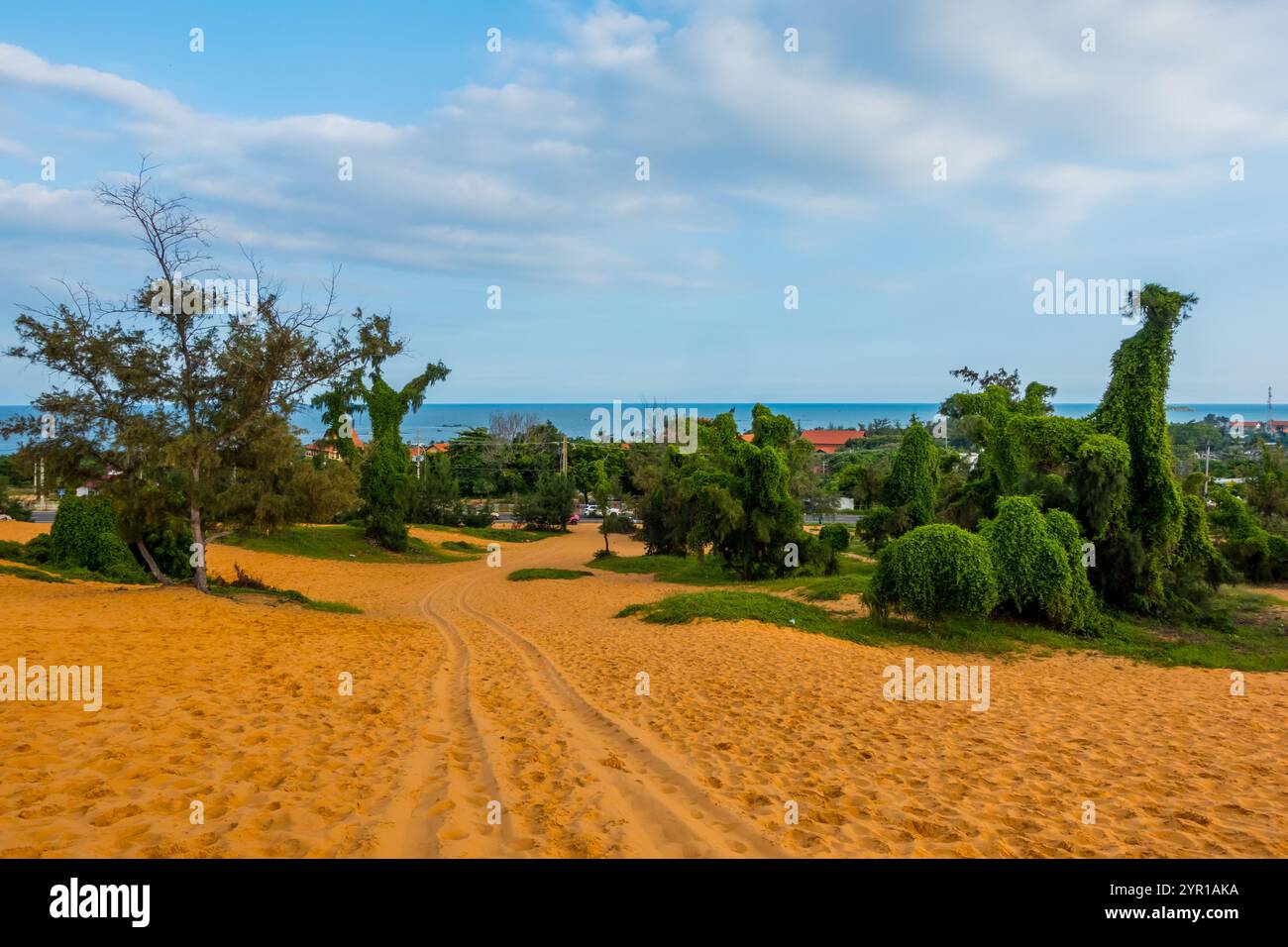 The stunning red sand dunes in Mui Ne, Vietnam at sunset Stock Photo ...