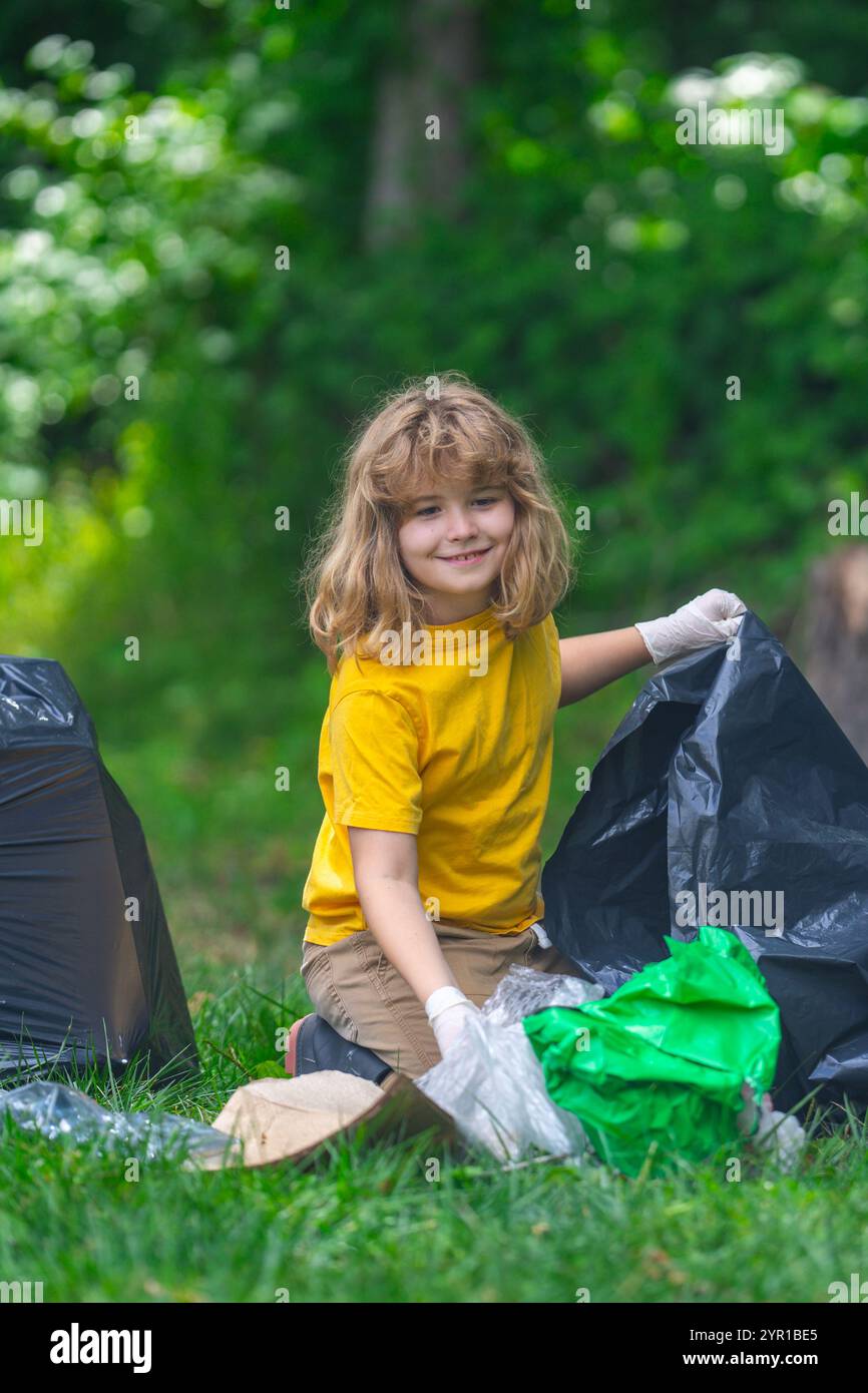 Child collecting trash outside. Ecology concept. Environmental ...