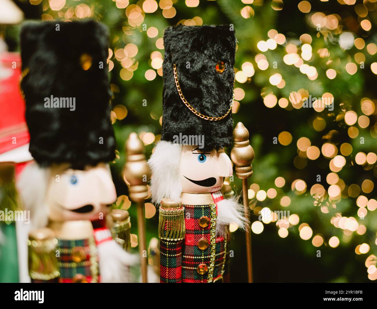 A large display of nutcrackers with a Merry Christmas sign. There are ...