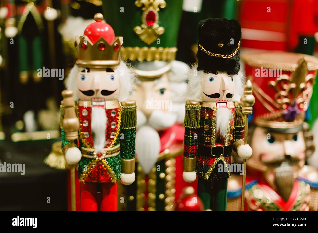 A large display of nutcrackers with a Merry Christmas sign. There are ...