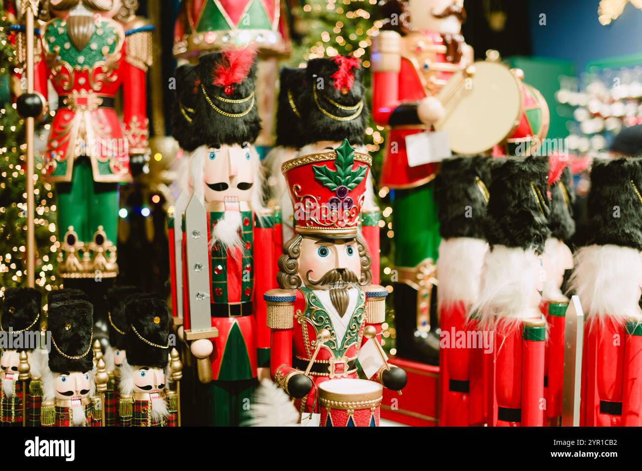 A large display of nutcrackers with a Merry Christmas sign. There are ...