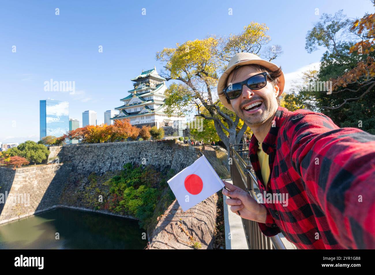 Man young travel tourist take a selfie with japan's flag at Osaka ...