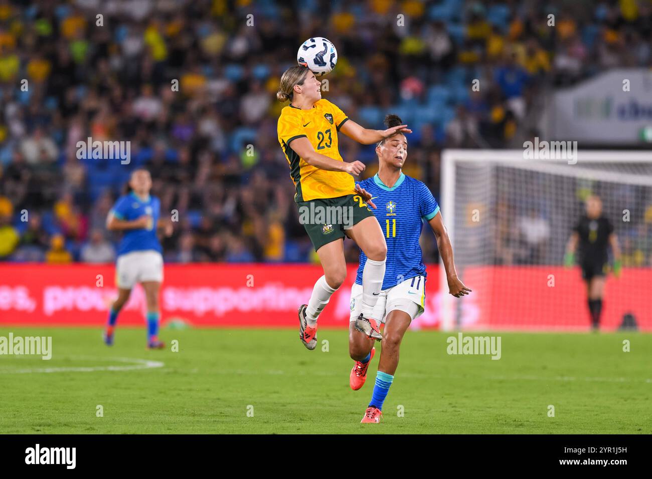 Matildas Kyra Cooney-Cross heading the ball during a friendly match ...