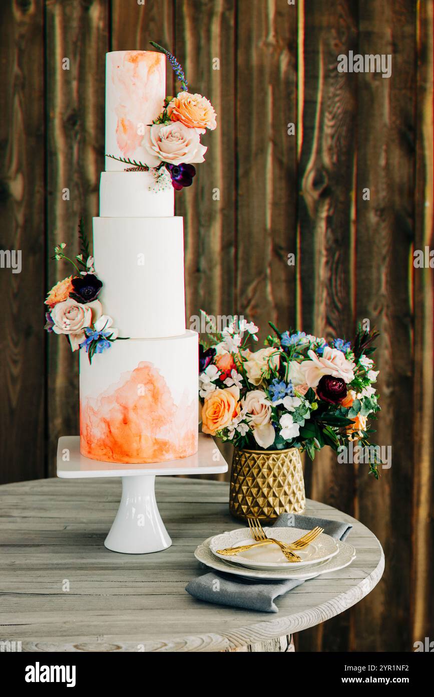 Tablescape with tiered wedding cake with watercolor accent Stock Photo ...