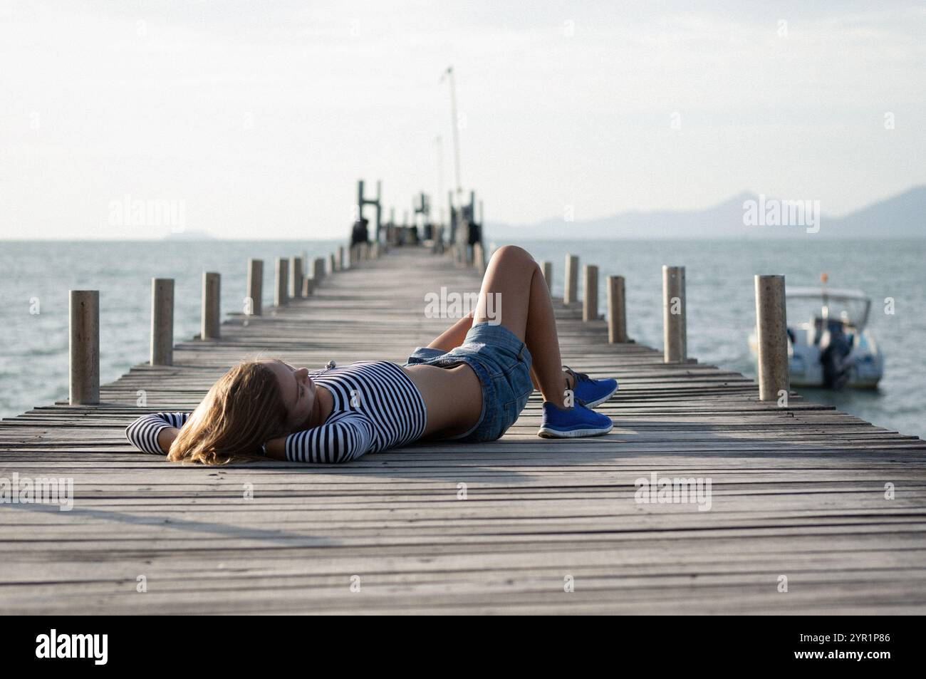 Woman lying on pier hi-res stock photography and images - Alamy