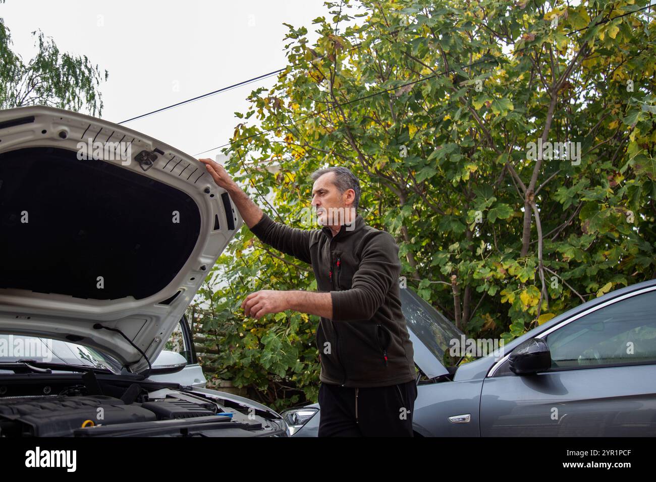 Man starting car engine hi-res stock photography and images - Alamy