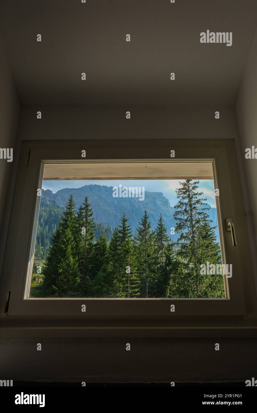 Looking out a window of a lodge at the Italian Dolomites Stock Photo ...