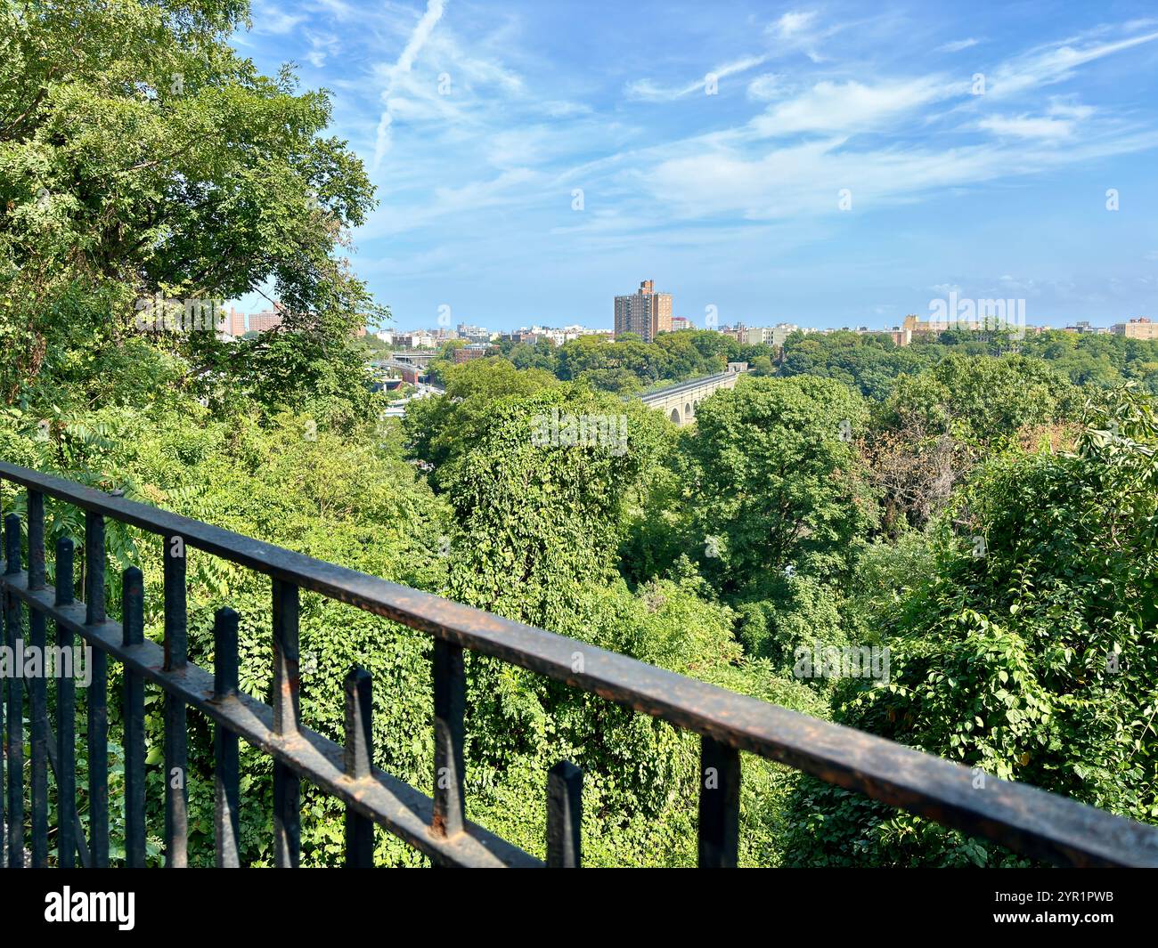 Urban landscape view from Highbridge Park with trees and buildings ...