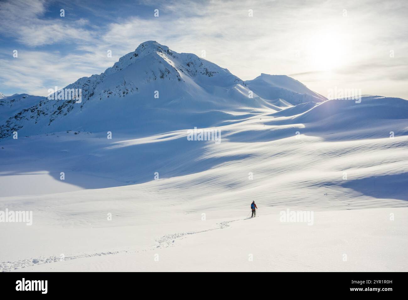 Rear view of skier touring toward Whirlwind Peak, Spearhead Traverse ...