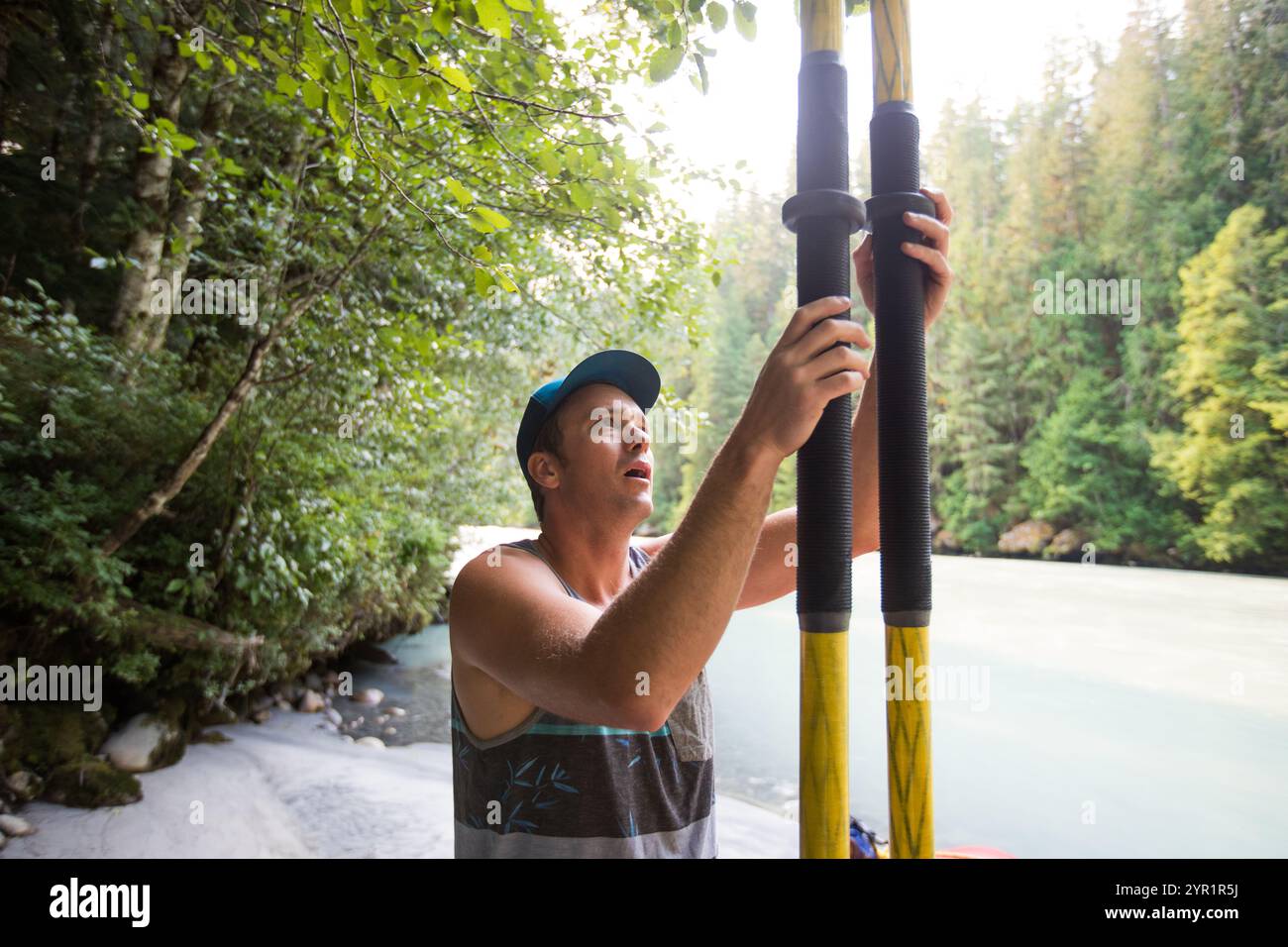 Raft guide sizes up his oar stops before a river trip Stock Photo - Alamy