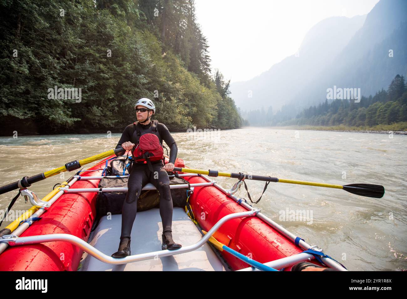 Outfitter / Raft guide uses oars to control whitewater raft Stock Photo ...