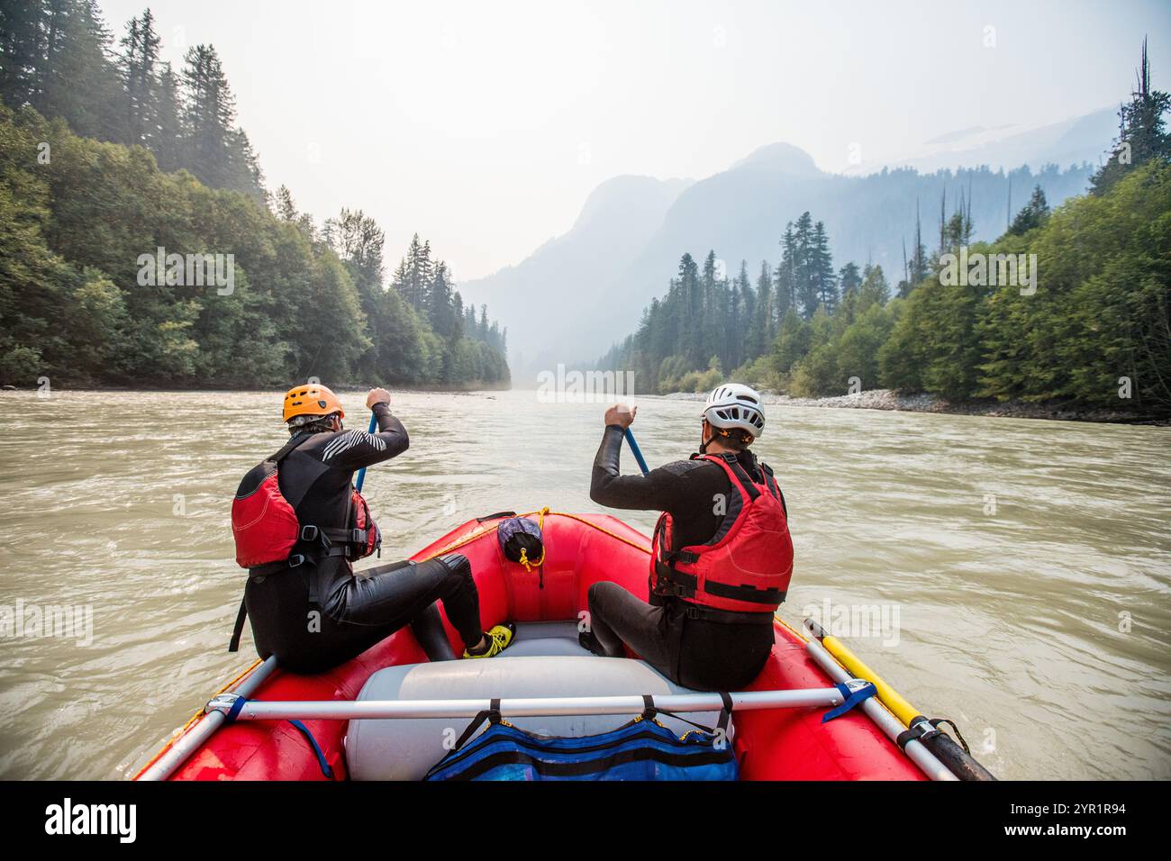 Two men paddling a whitewater raft on the Squamish River Stock Photo ...