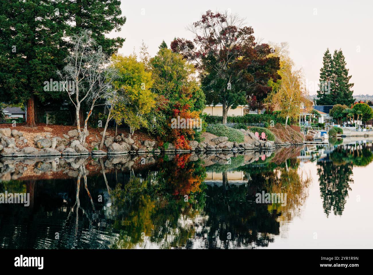Colorful autumn lakefront residential scene Stock Photo - Alamy