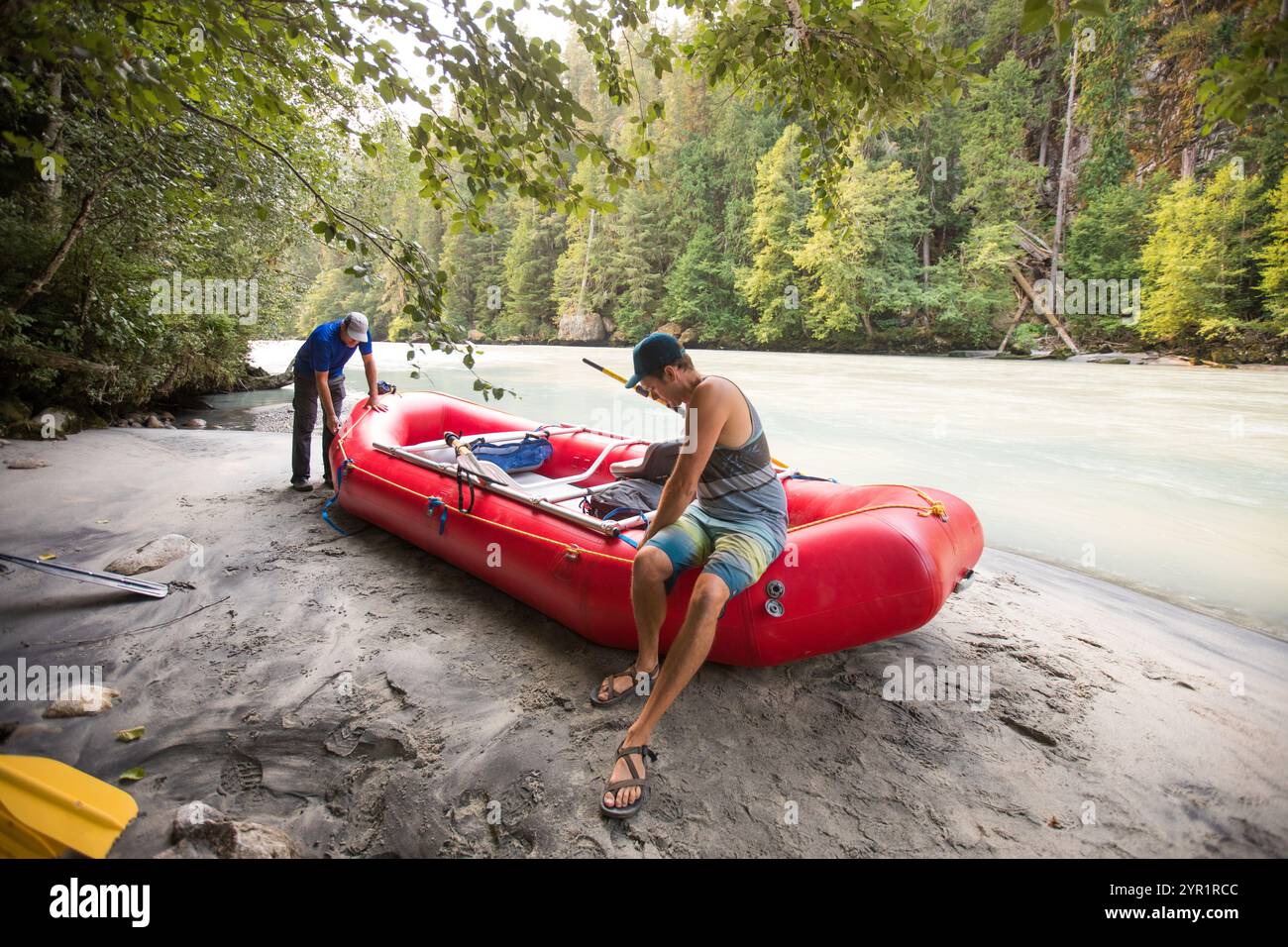Two guides work to inflate raft before a whitewater river trip Stock ...