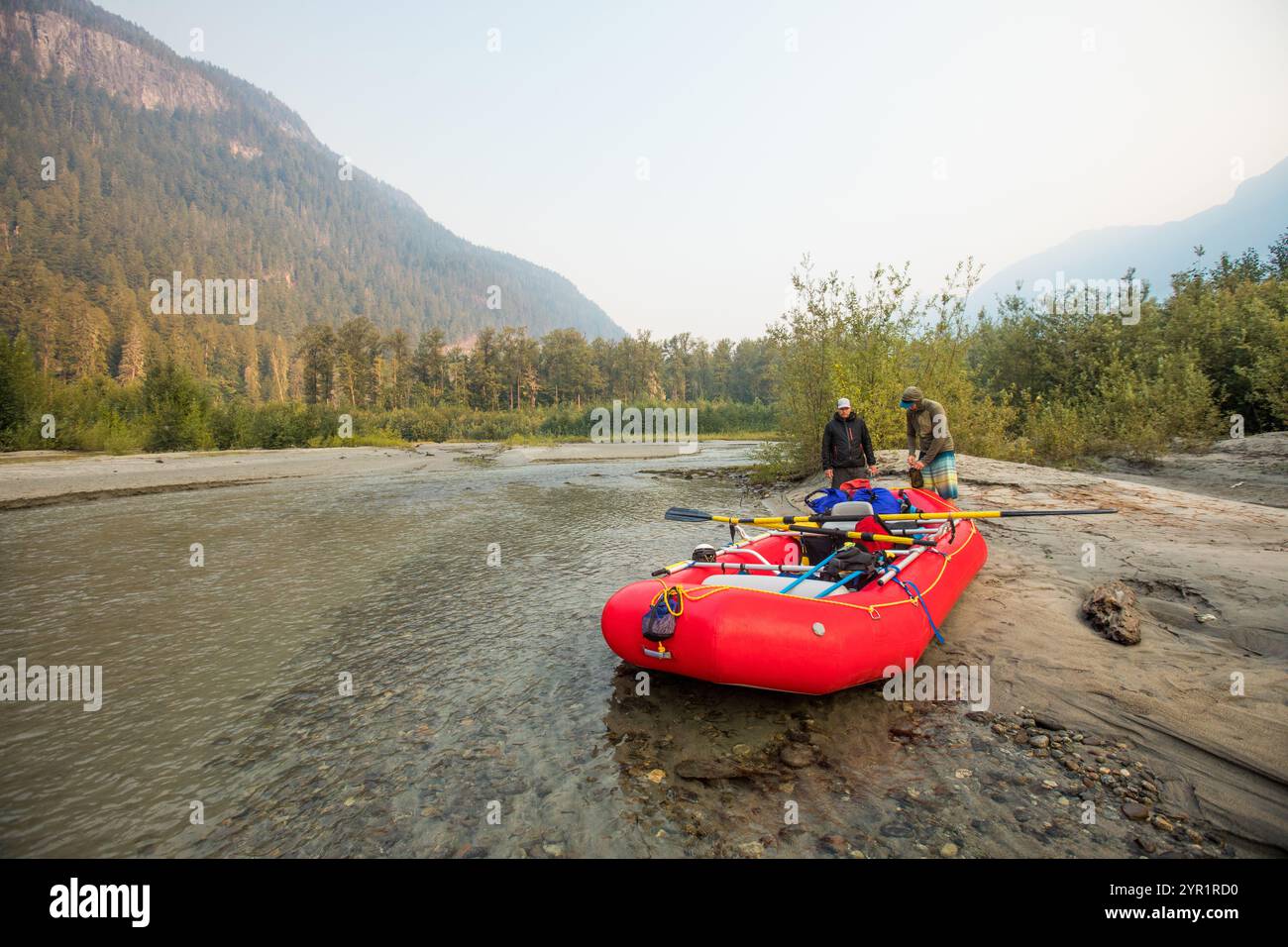 Two men prepare their raft for a day on the river Stock Photo - Alamy