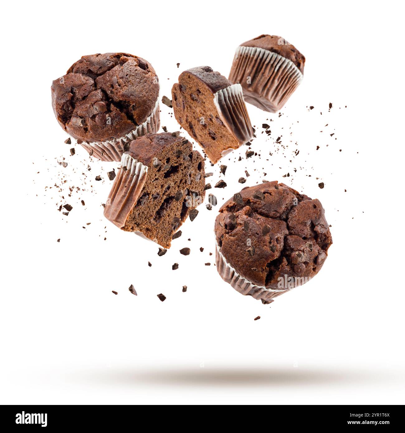 Chocolate chip muffins flying with chocolate chips on white background ...