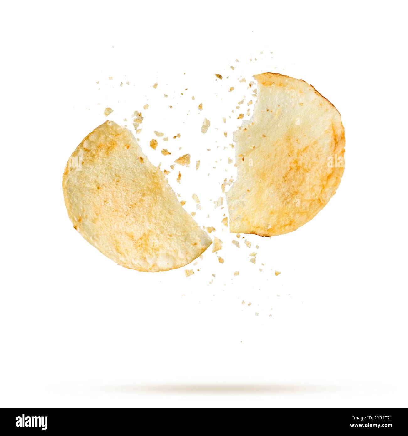 Broken potato chip with crumbs falling, isolated on white background ...