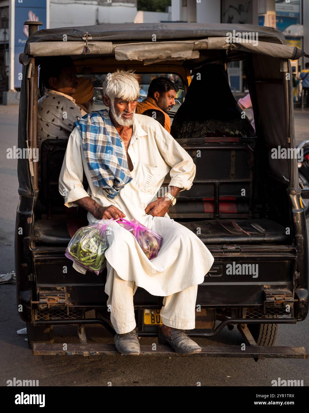Elderly man riding in the back of a tuk tuk, Gujarat, India Stock Photo ...
