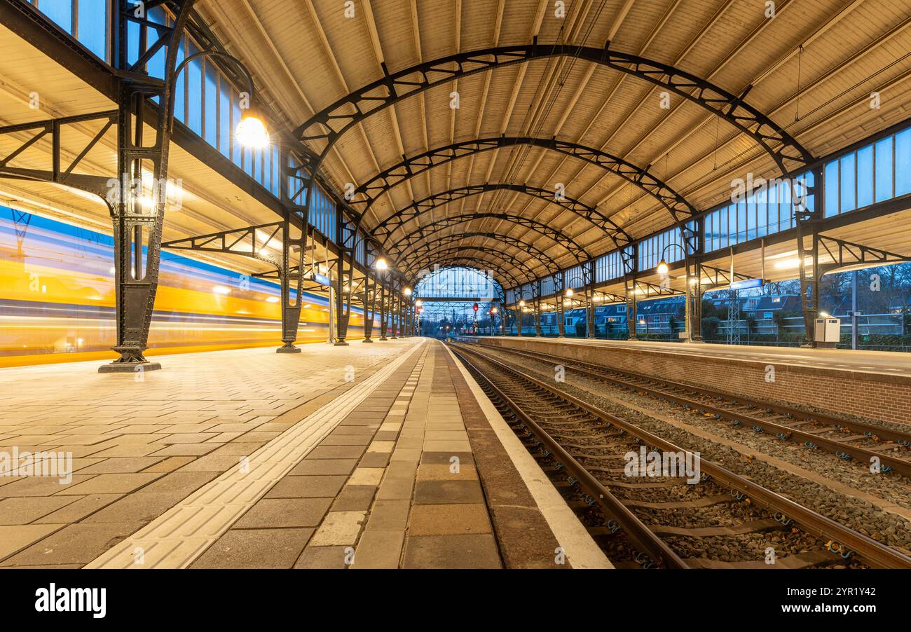 Long exposure of dutch train passing through station Haarlem ...