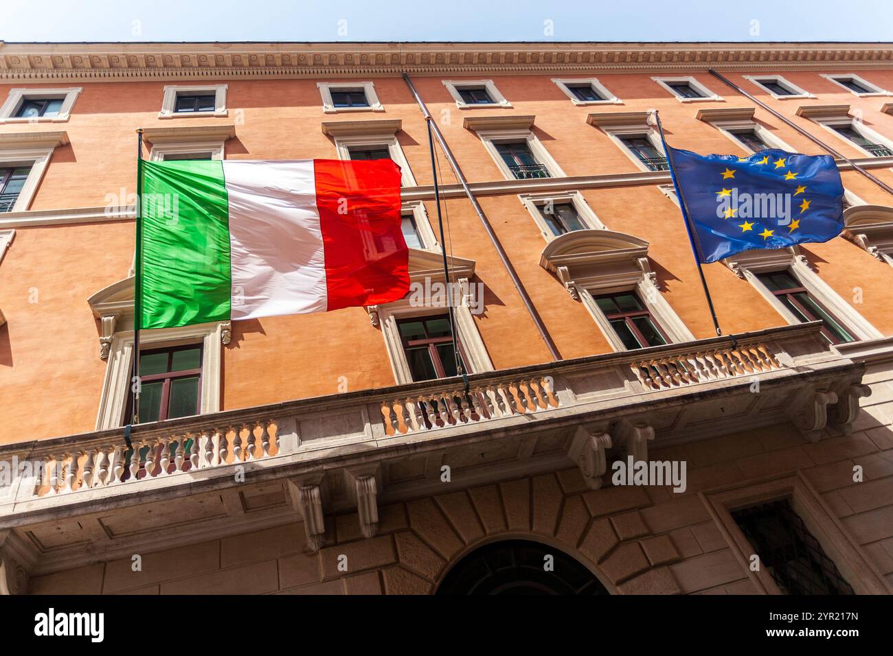 Italian and EU flags display on historic Rome building facade Stock ...
