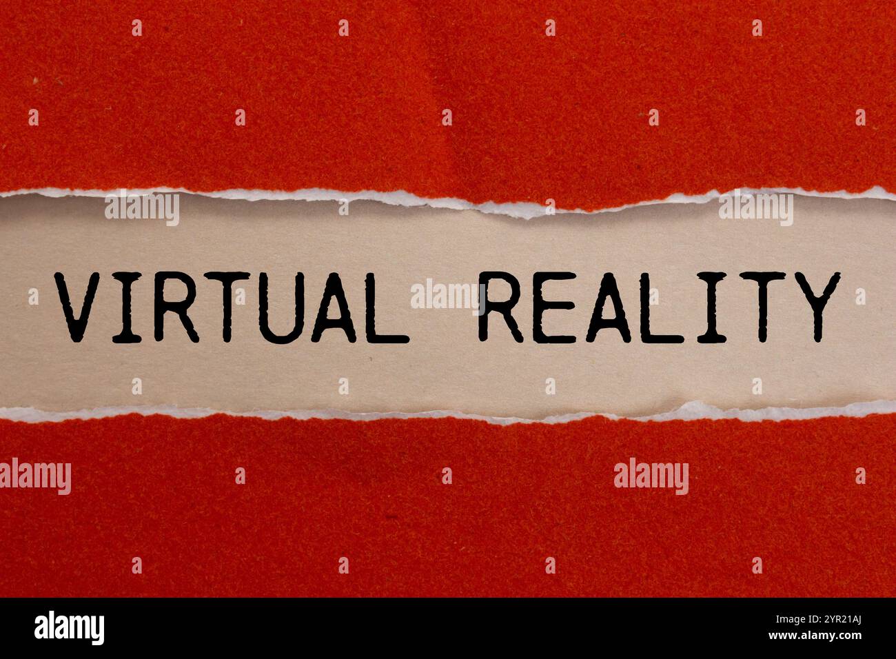 Virtual reality message written on ripped torn red paper with beige ...