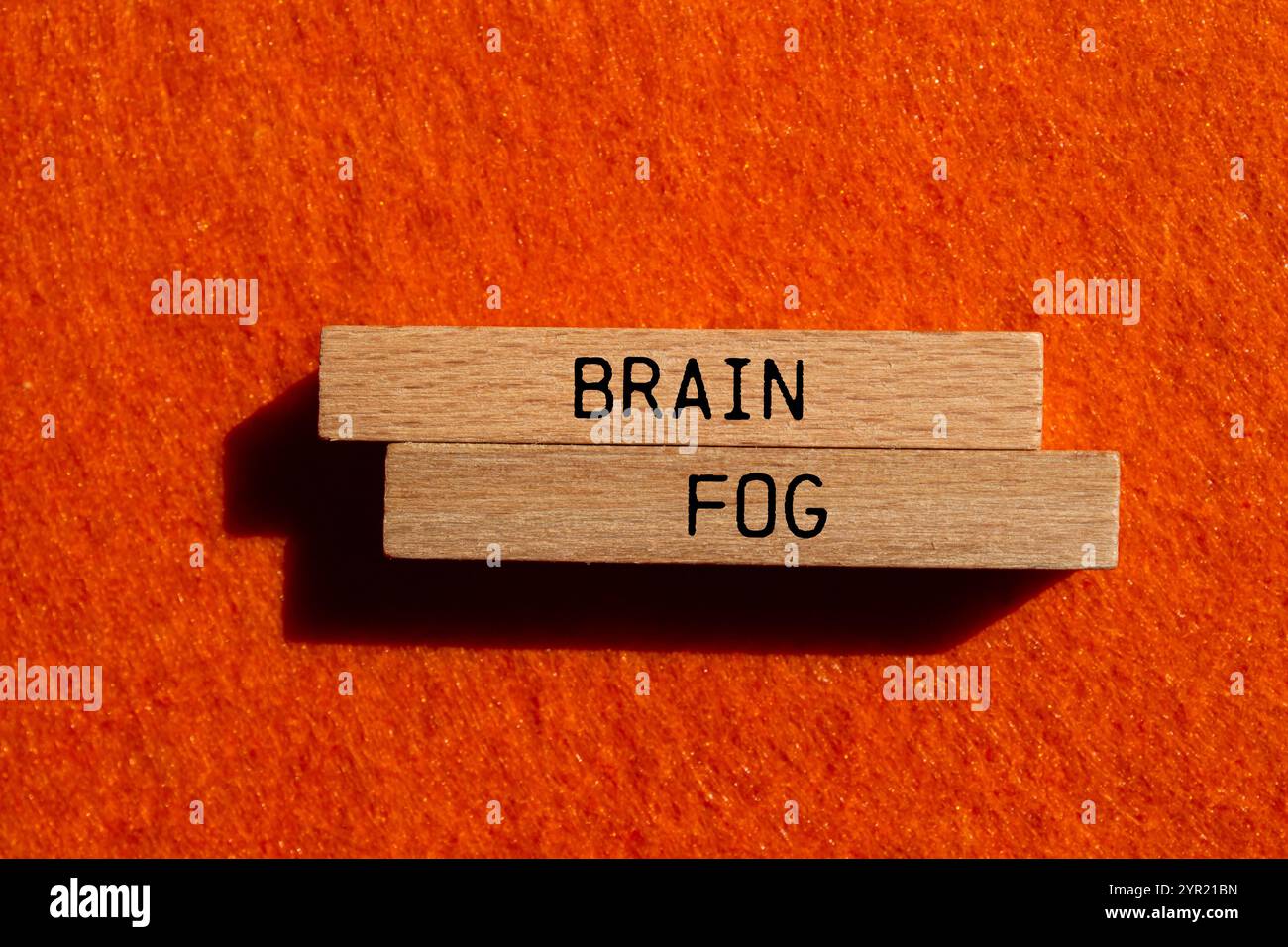 Brain fog message written on wooden blocks with orange background ...