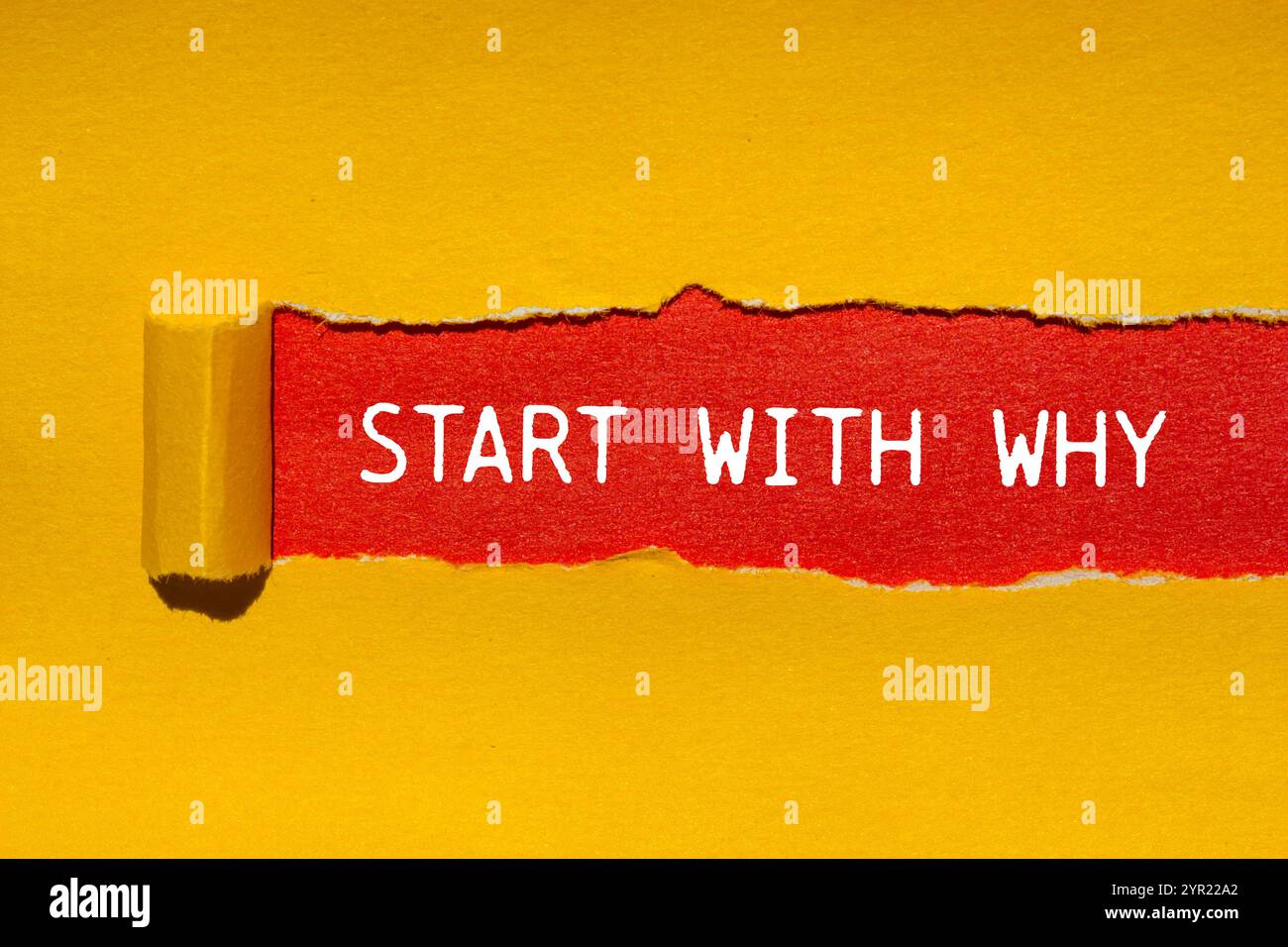 Start with why message written on ripped torn yellow paper with red background. Conceptual start ...