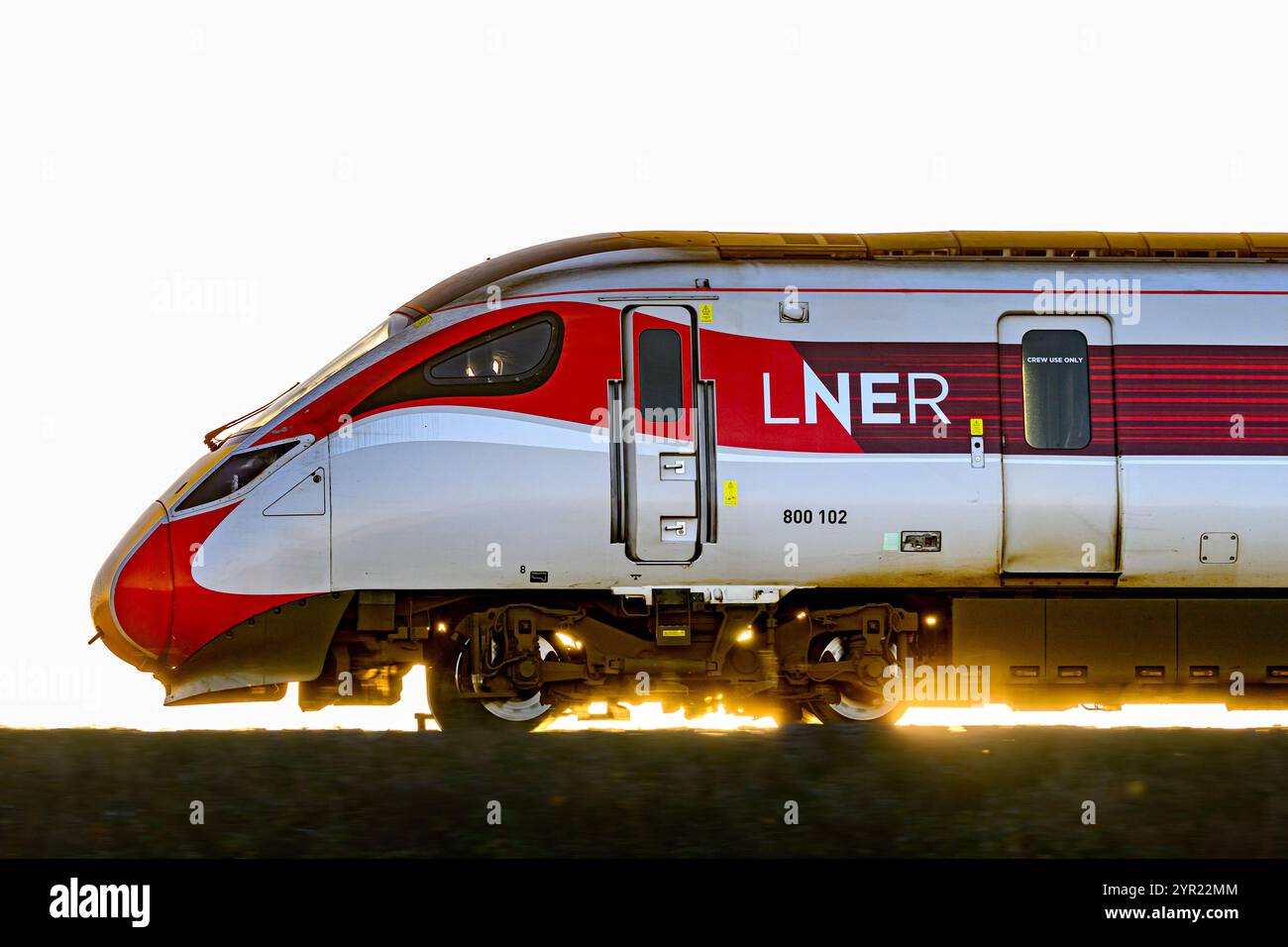 A LNER Azuma Train (800102), Backlit By A Setting Sunset, As It Travels ...
