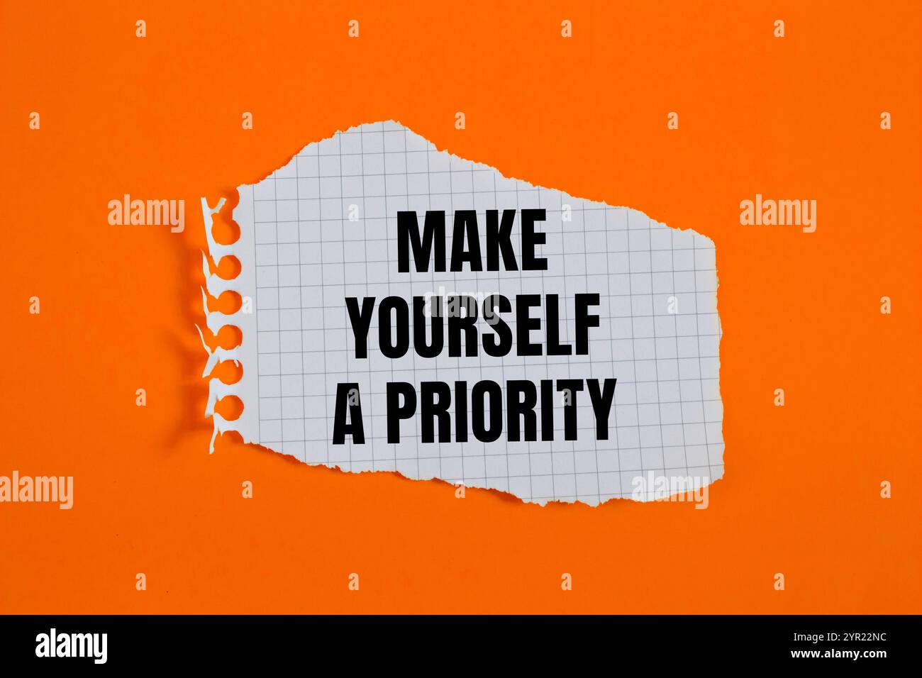 Make yourself a priority message written on ripped torn checkered graph ...